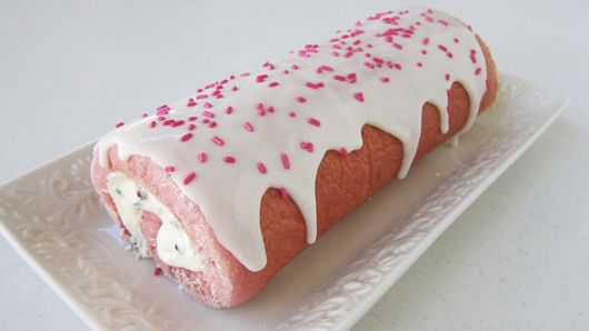 Pink Velvet Roll Cake with Rainbow Chip Frosting Recipe - Tablespoon.com